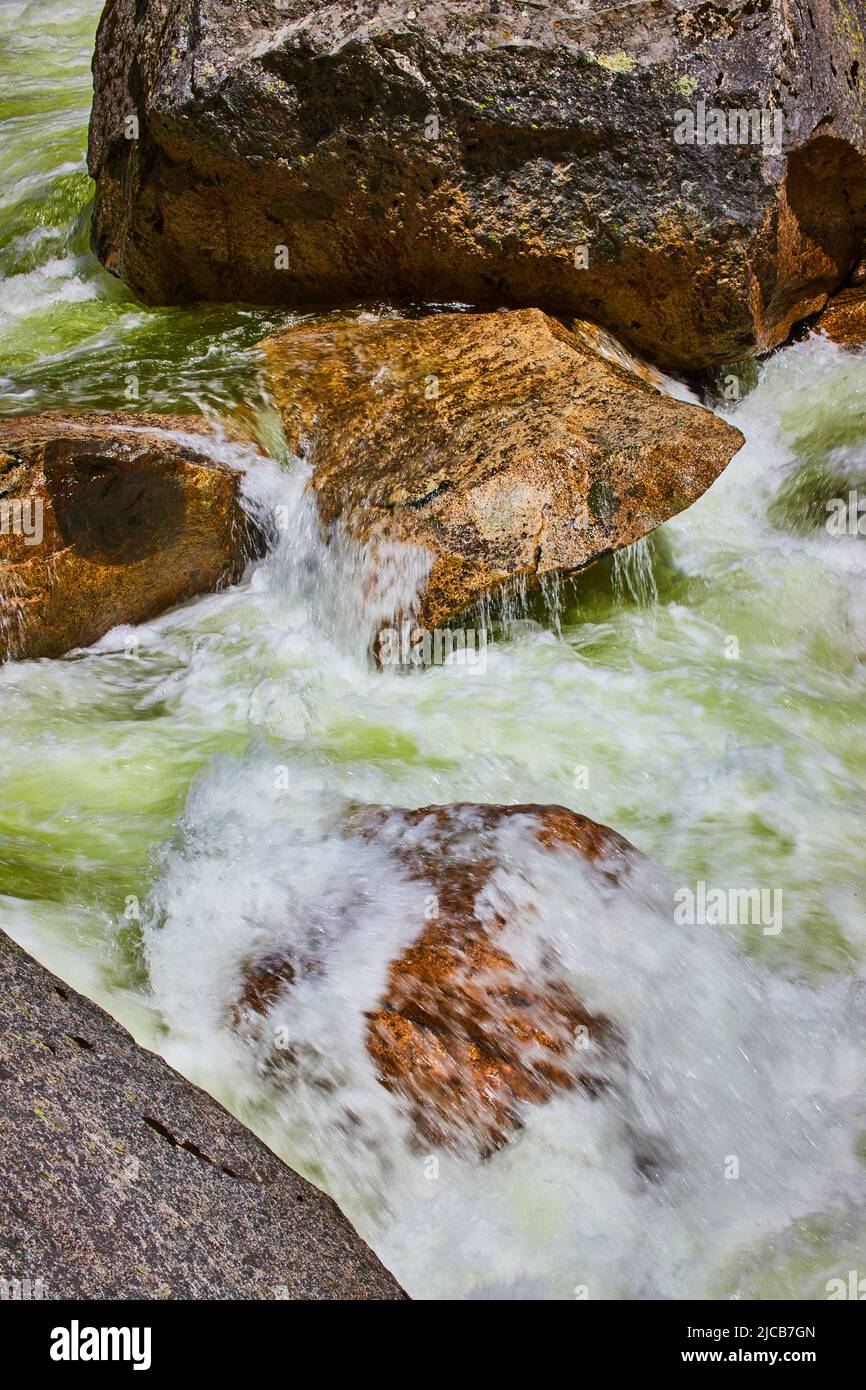 River with sharp piece of rock and water cascading over top Stock Photo ...