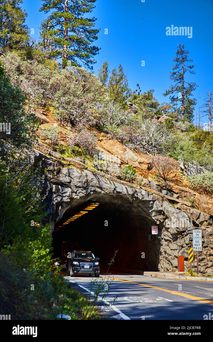 Mile long tunnel leading into Yosemite National Park with car Stock ...