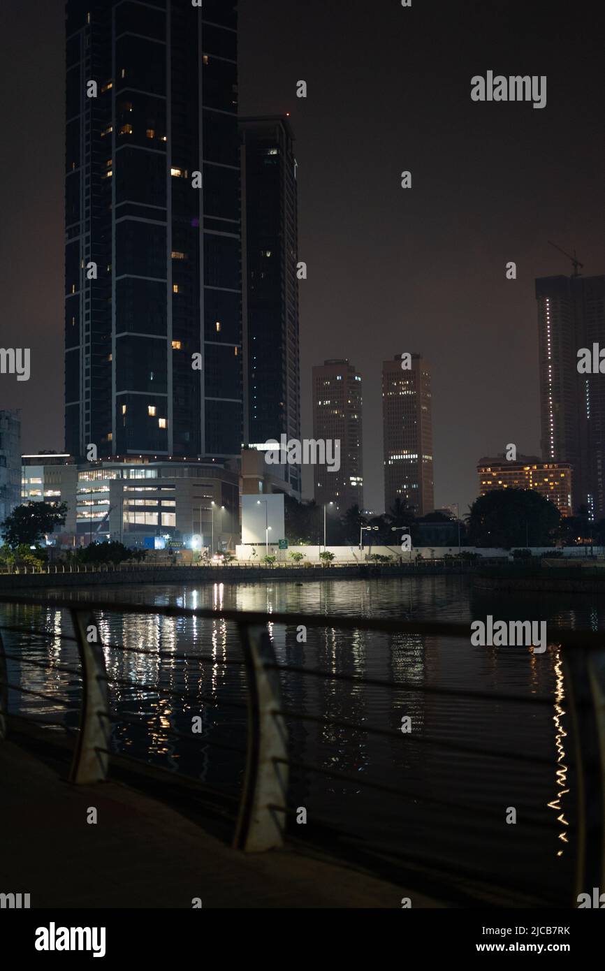 Night sight of cityscape architecture and buildings reflected with ...