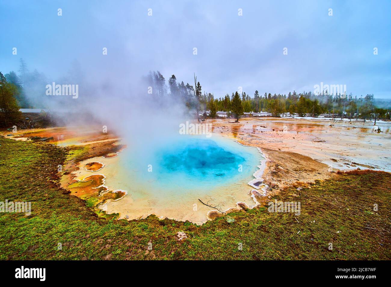 Stunning and steamy deep blue pool in Yellowstone Stock Photo - Alamy