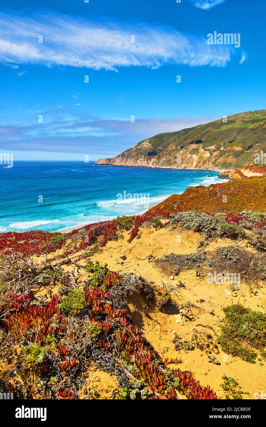 Ocean waves hitting west coast next to sandy beaches and colorful ...