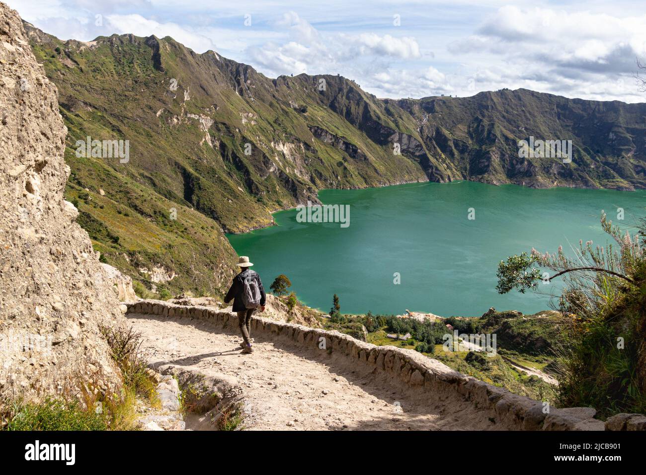 Lake Quilotoa in caldera of eponymous volcano Quilotoa. Hiking patch ...