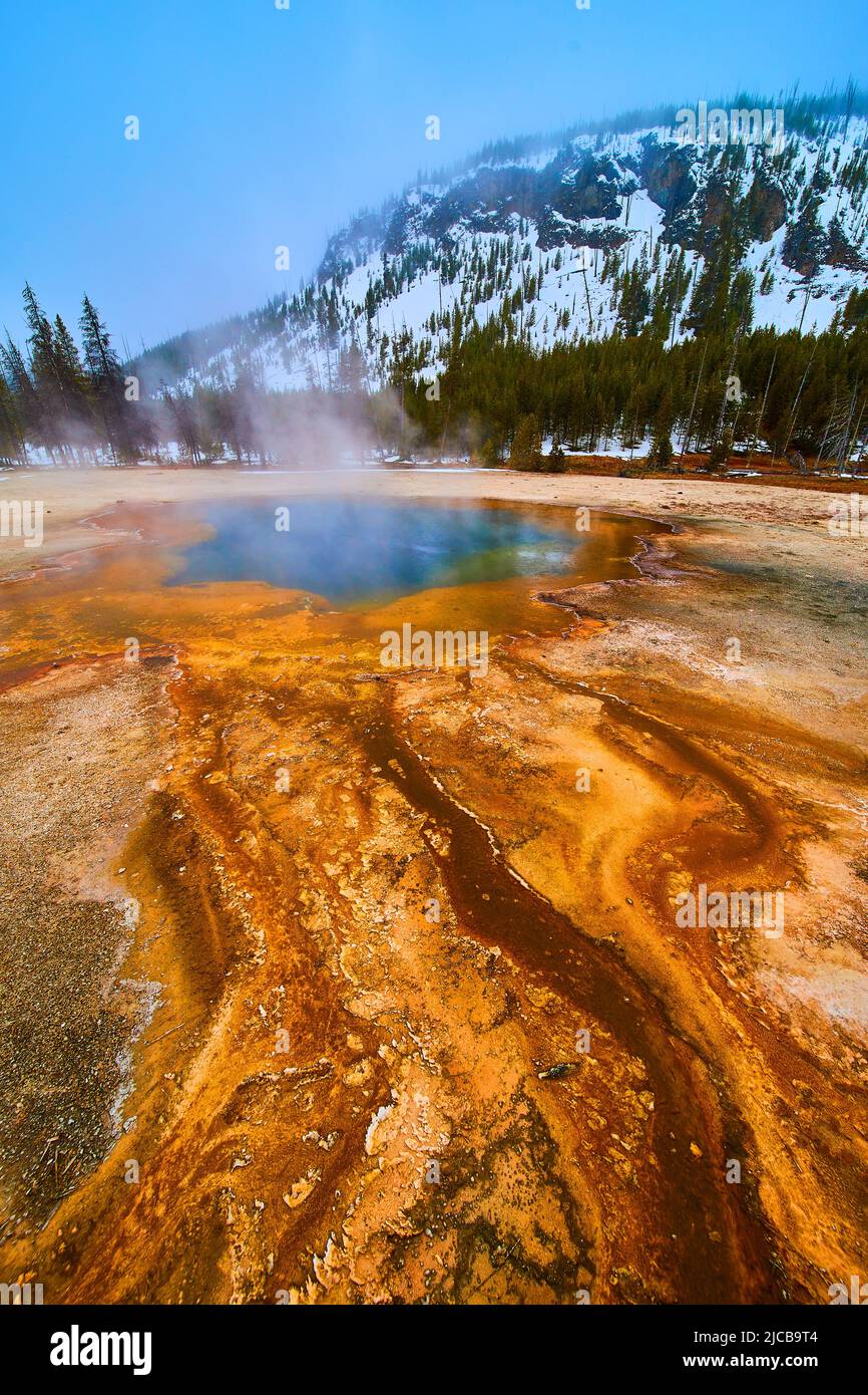 Stunning colors of pools at basin in Yellowstone during winter Stock ...
