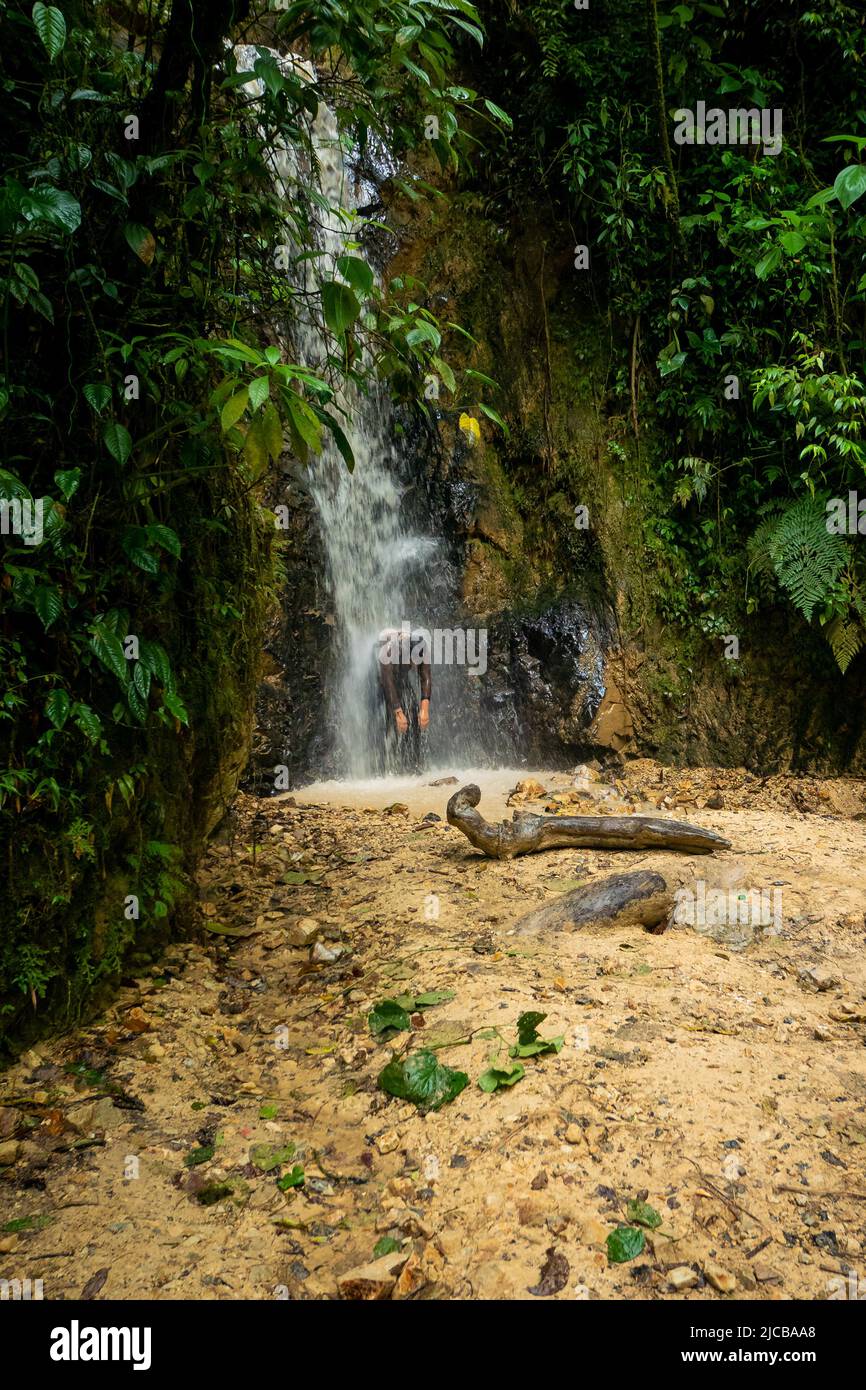 Woman bathing in waterfall hi-res stock photography and images - Alamy