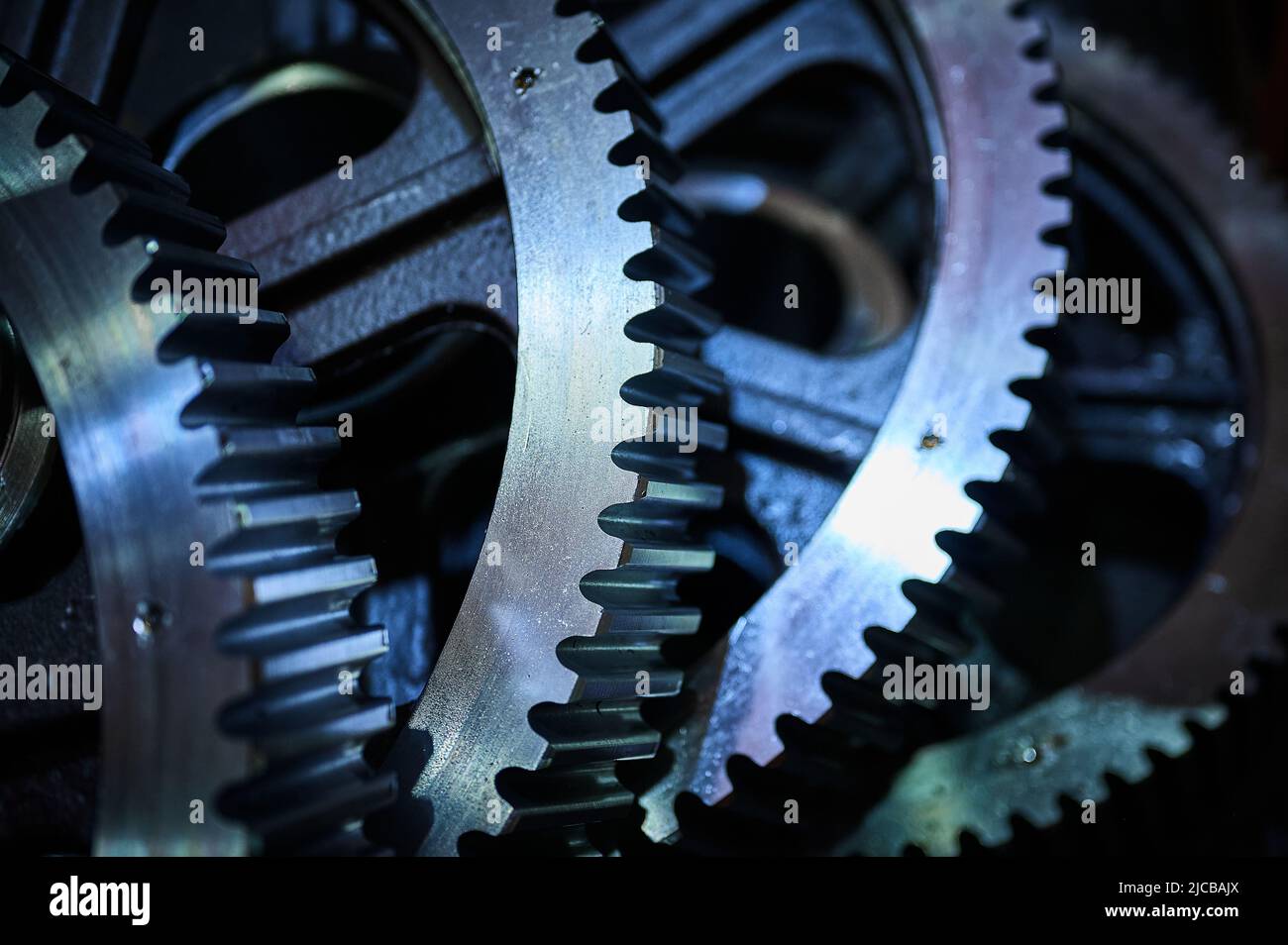 Pile of metal cogwheels for spiral gear drive in warehouse Stock Photo ...