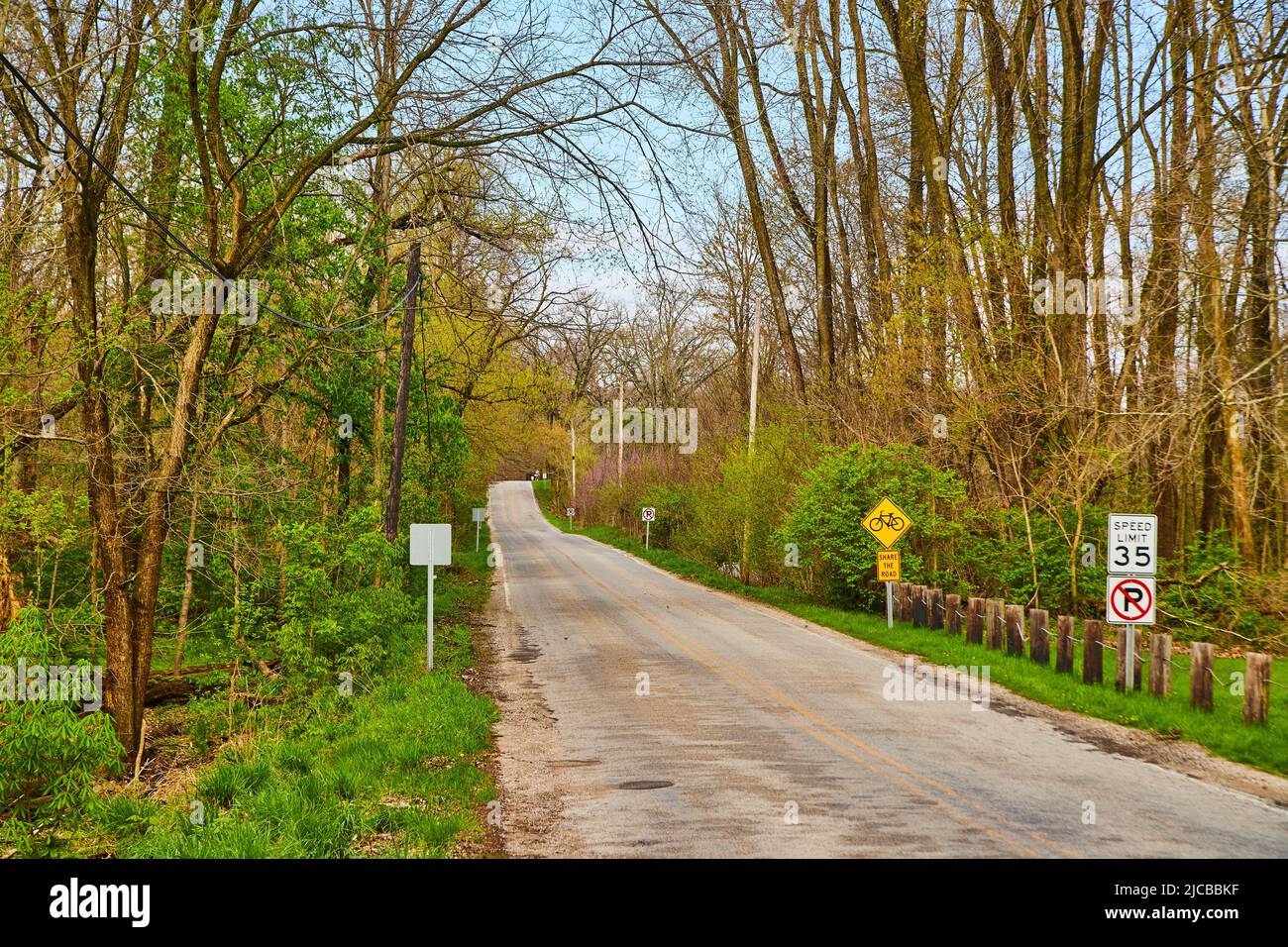 Midwest side road in late spring with budding leaves Stock Photo - Alamy