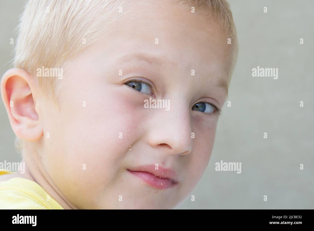 beautiful blond boy with blue eyes looked sideways portrait Stock Photo ...
