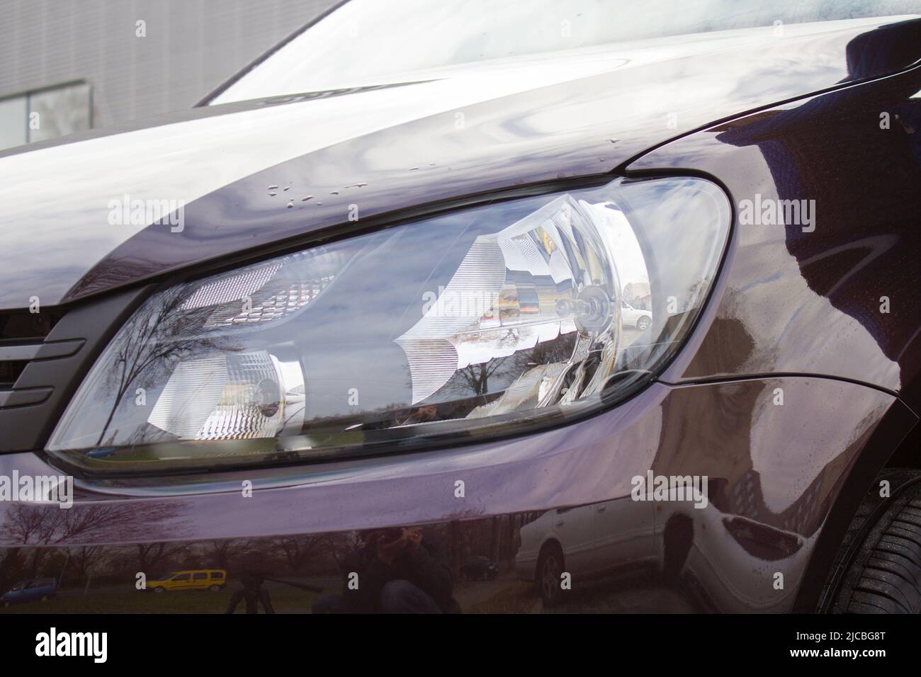 elegant design of modern car headlight close Stock Photo - Alamy