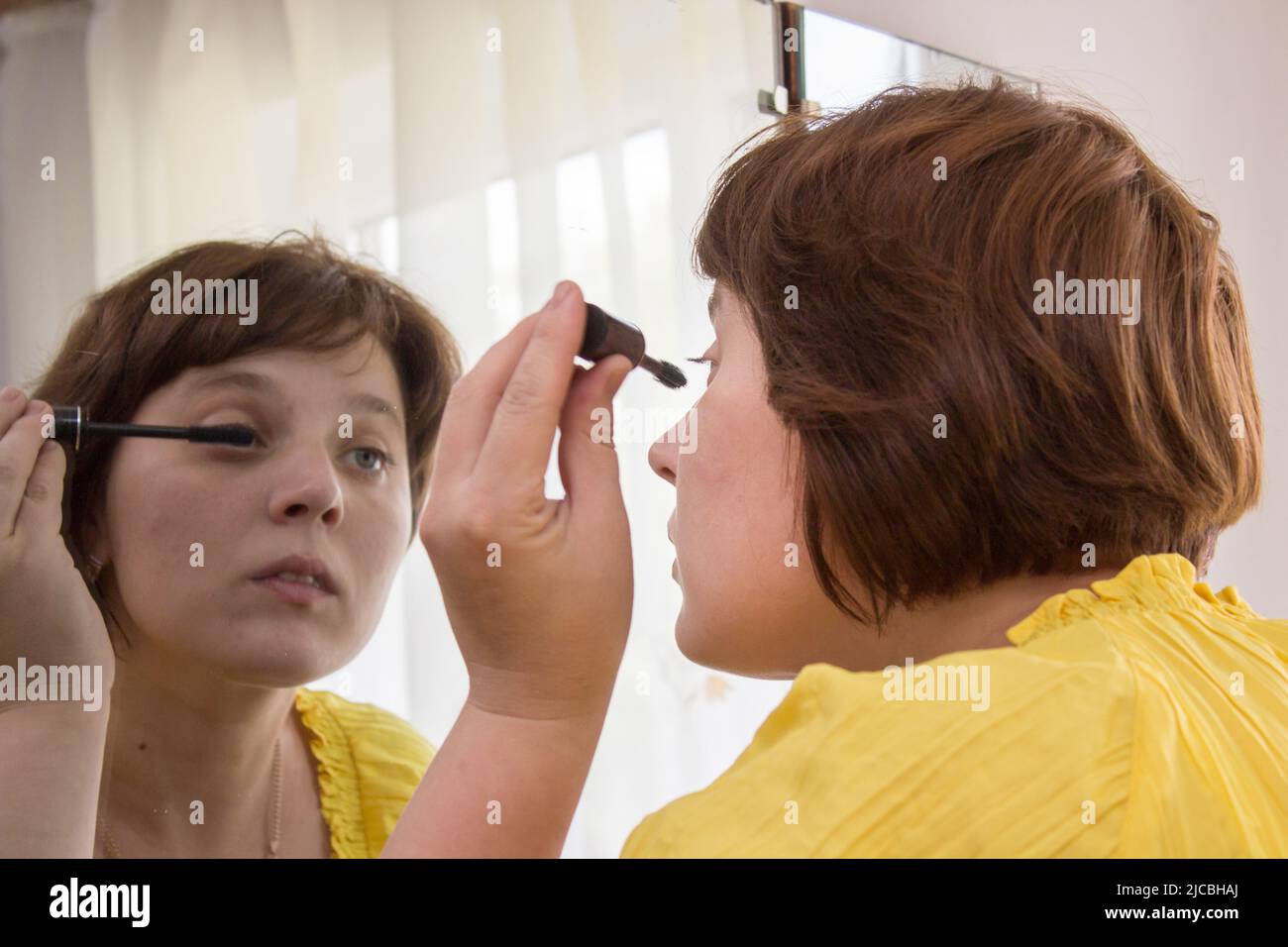 woman in cosmetic mirror Stock Photo - Alamy