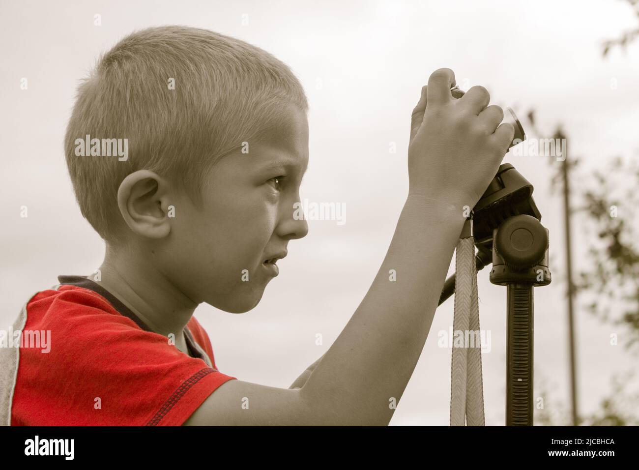 Little boy with an new camera shooting outdoor Stock Photo - Alamy