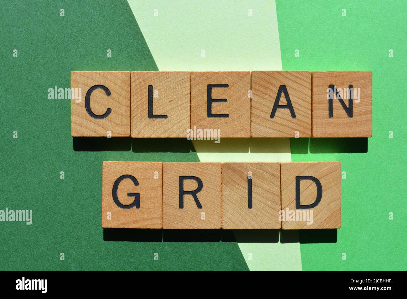Clean Grid, words in wooden alphabet etters isolated on green ...
