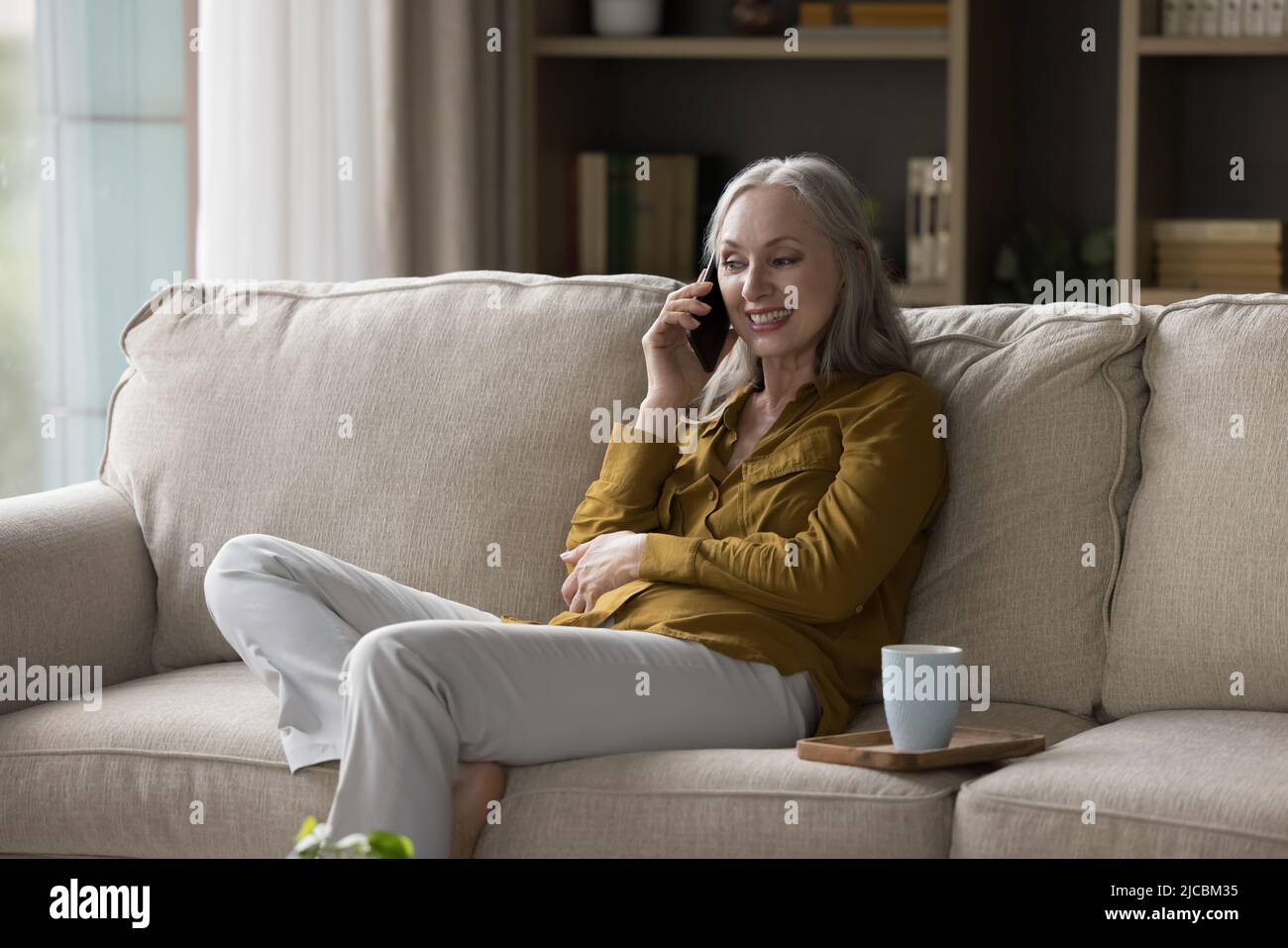 Mature woman call seated hi-res stock photography and images - Alamy