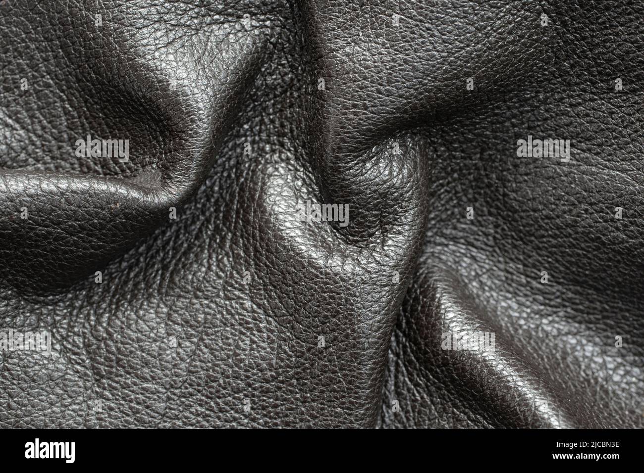 Selective focus photo of black leather creases, macro Stock Photo - Alamy