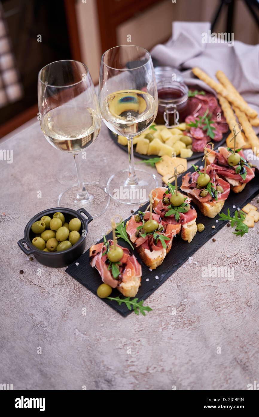 bruschetta with prosciutto ham and capers with traditional antipasto ...