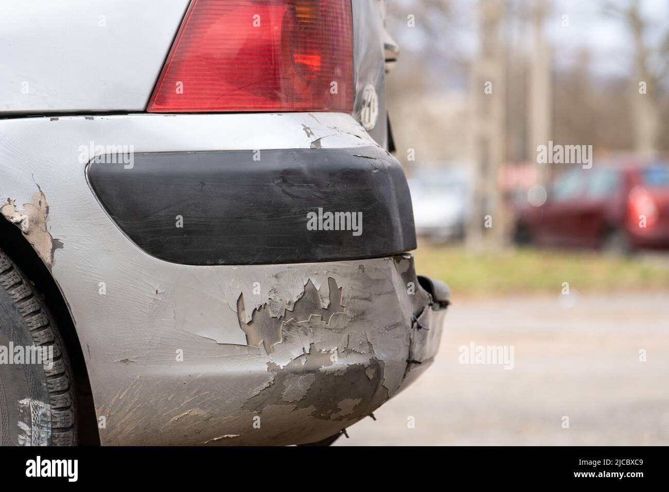 damaged parking car in an outdoor parking place Stock Photo - Alamy