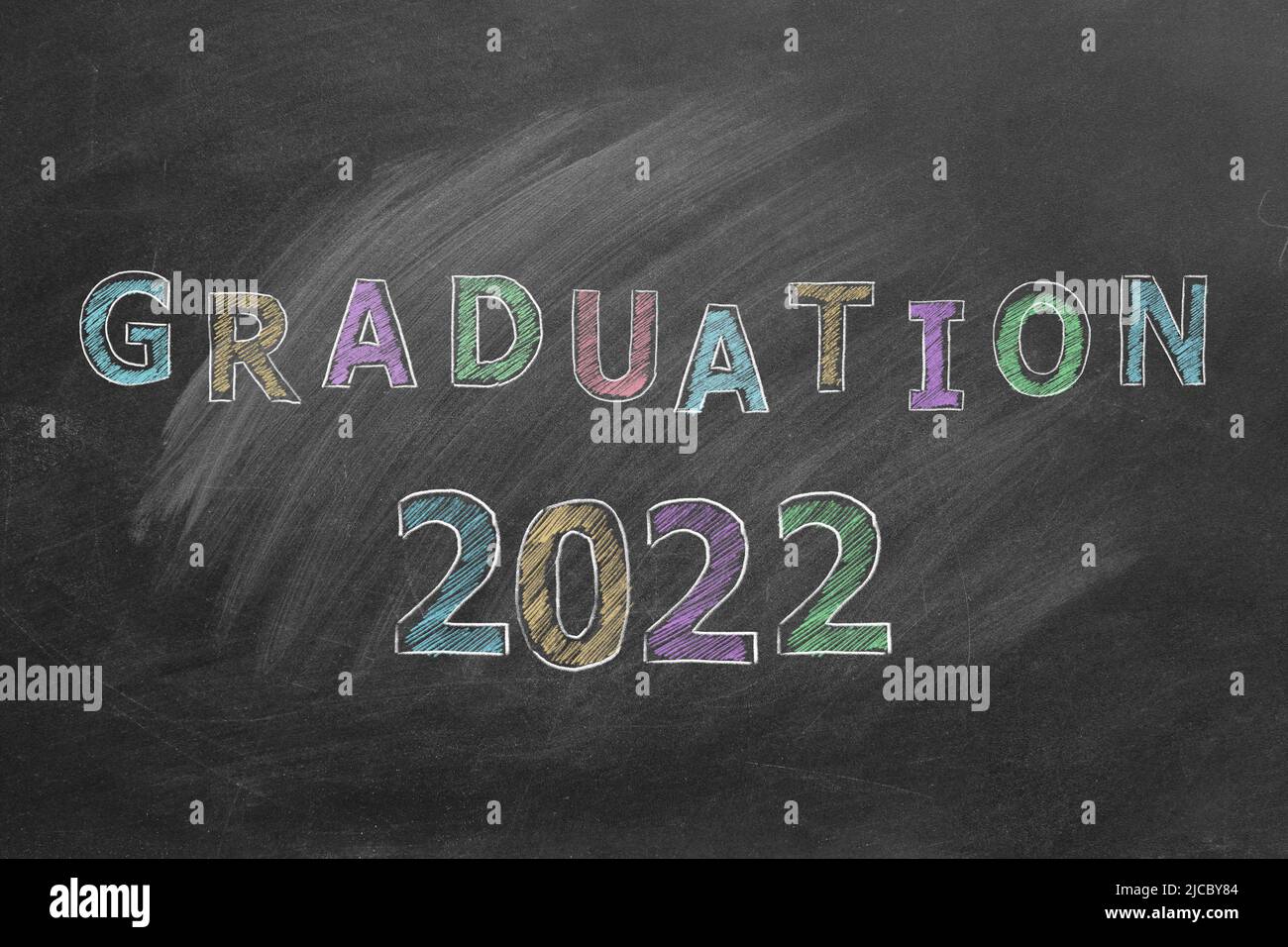 Lettering GRADUATION 2022 written in color chalk on a blackboard Stock ...