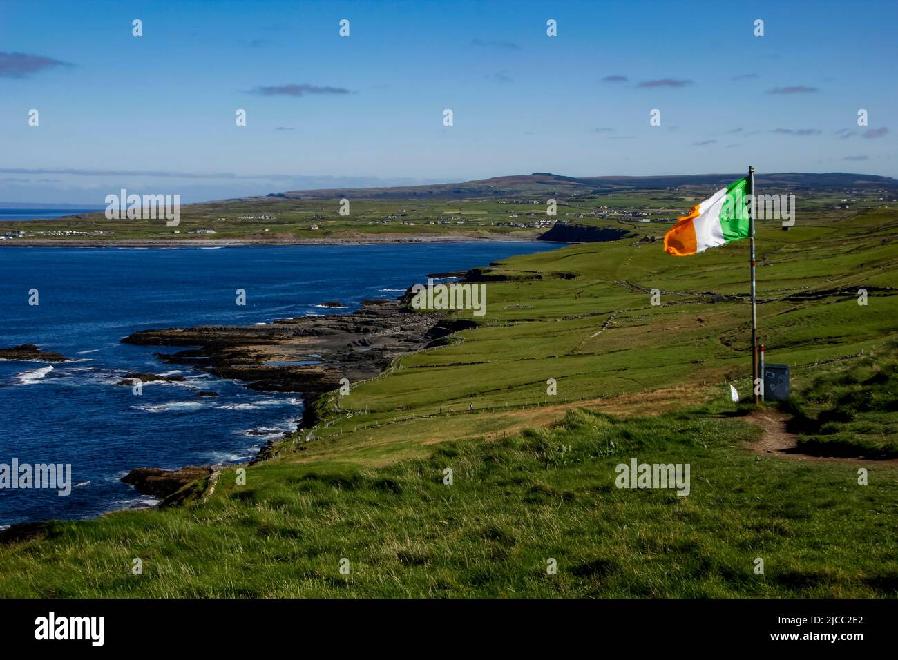 Irish flag at the hiking trail leading from Doolin to the Cliffs of ...