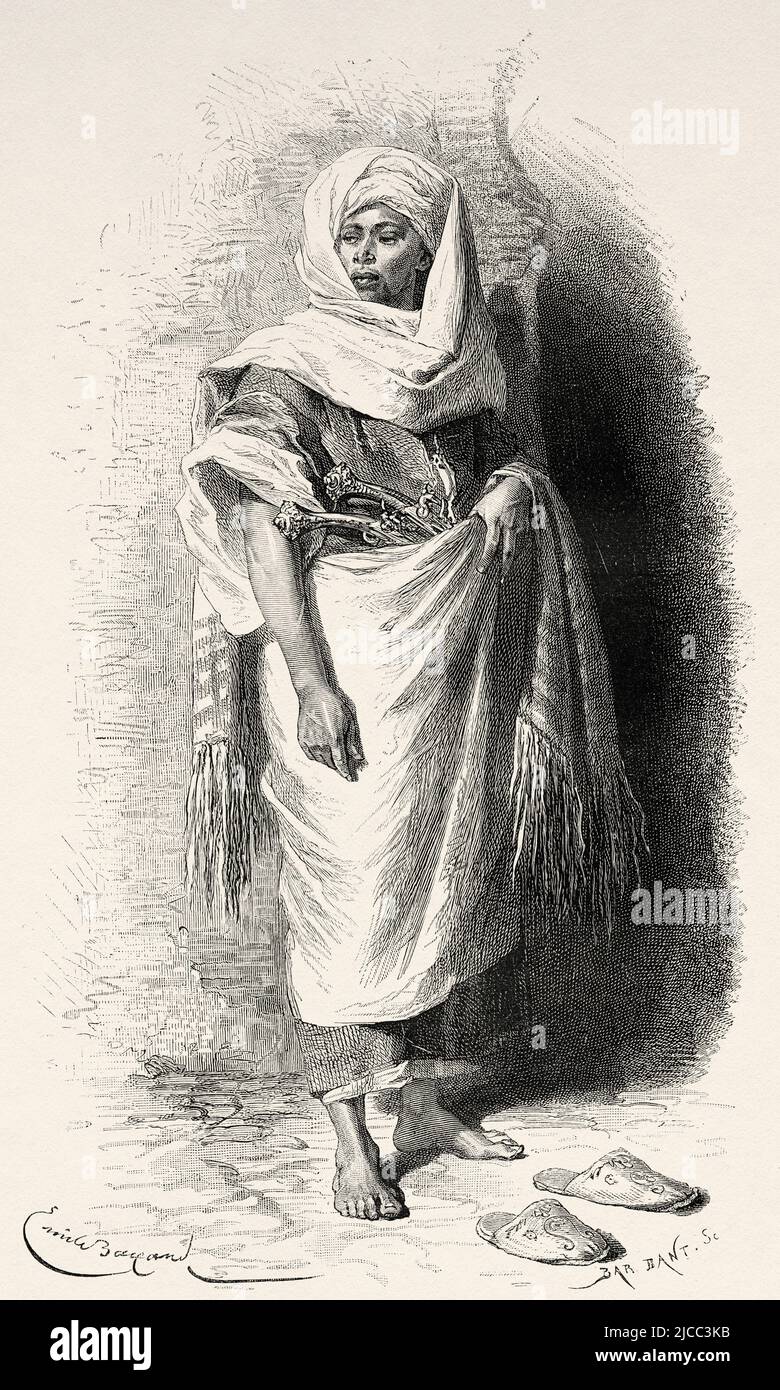A young Moorish man dressed in traditional Moroccan dress, Tangier ...