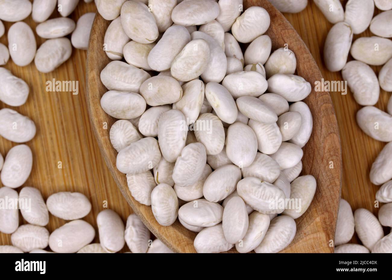 Close-up organic white beans background Stock Photo - Alamy