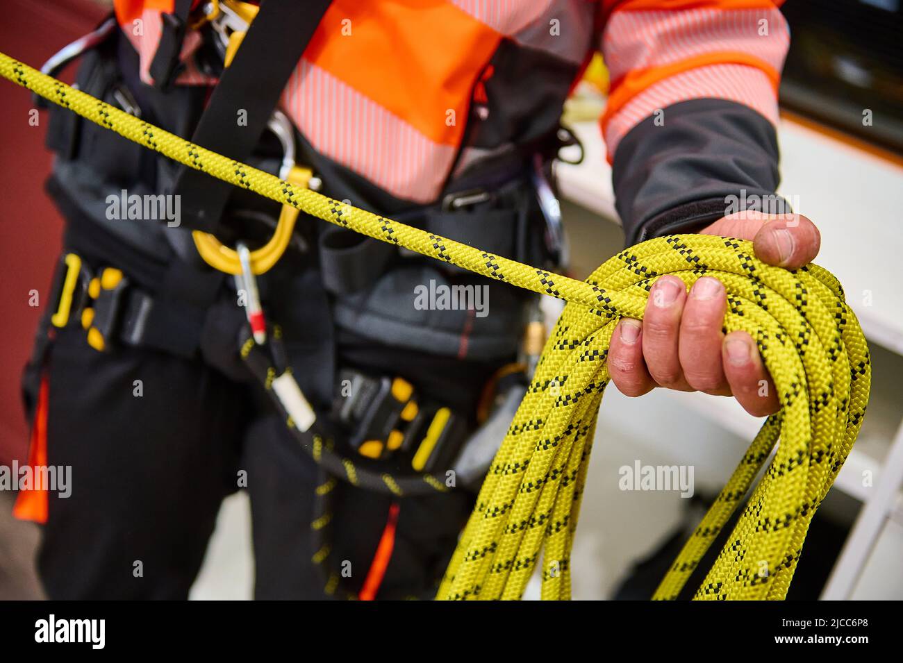detail of the hands of a climber with the safety rope in hand Stock ...