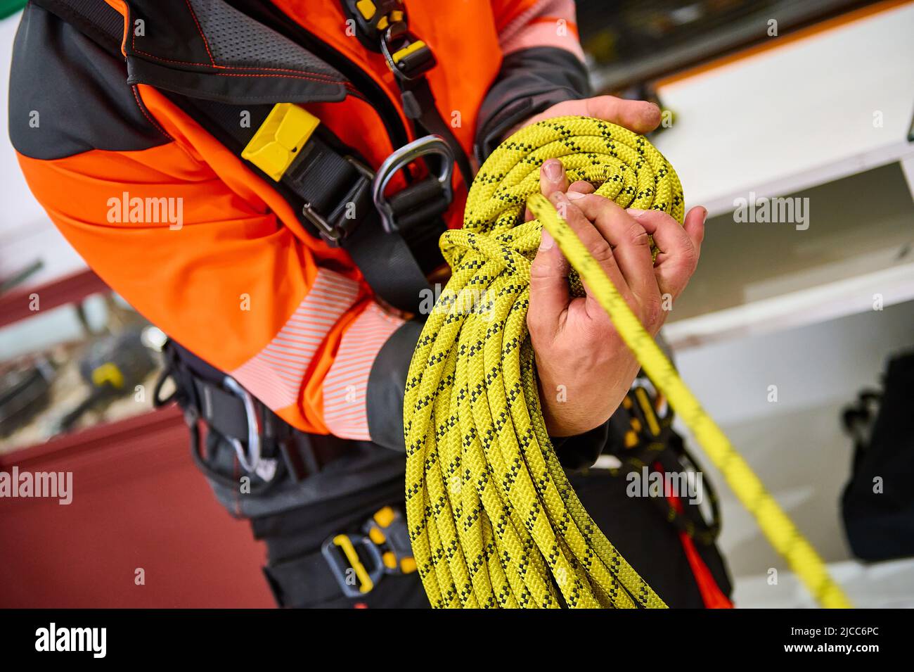 detail of the hands of a climber with the safety rope in hand Stock ...