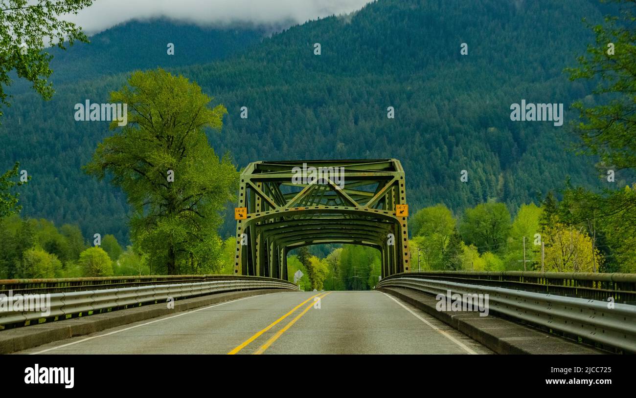 Old iron bridge in the background of mountains, Washington state, USA ...