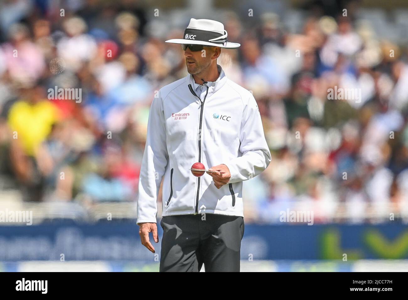 The umpire check the ball in the gauge during the game Stock Photo - Alamy