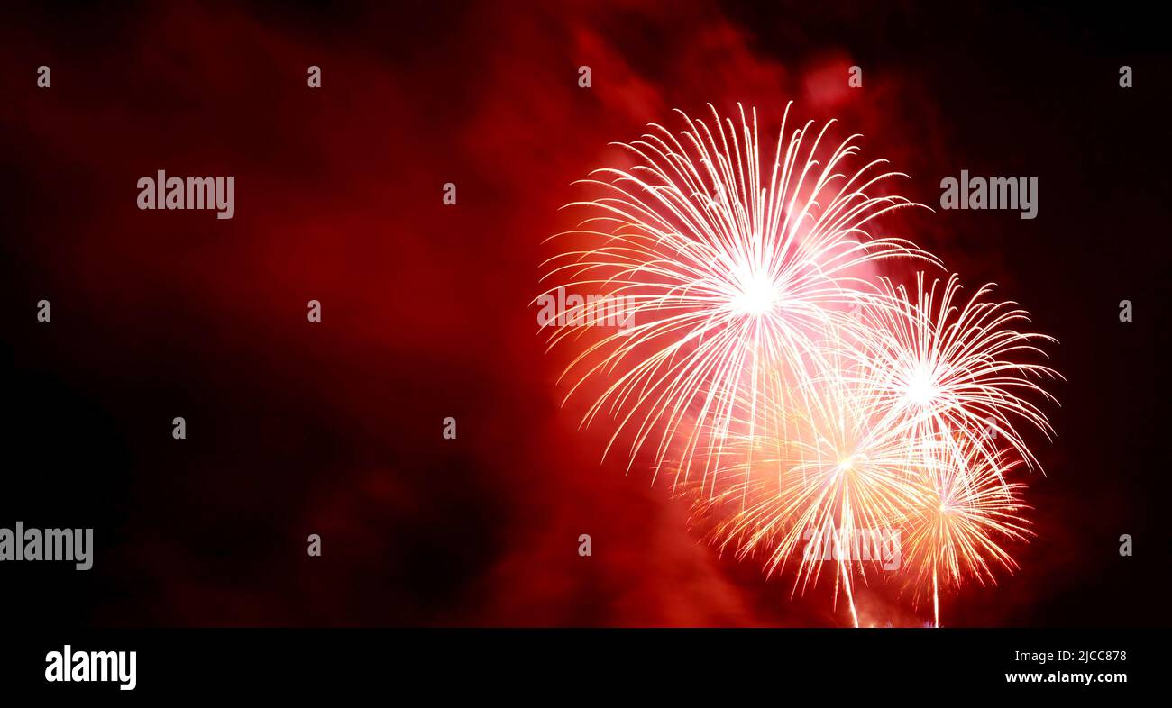 Spectacular gradient scarlet fireworks splashing in the night sky Stock ...