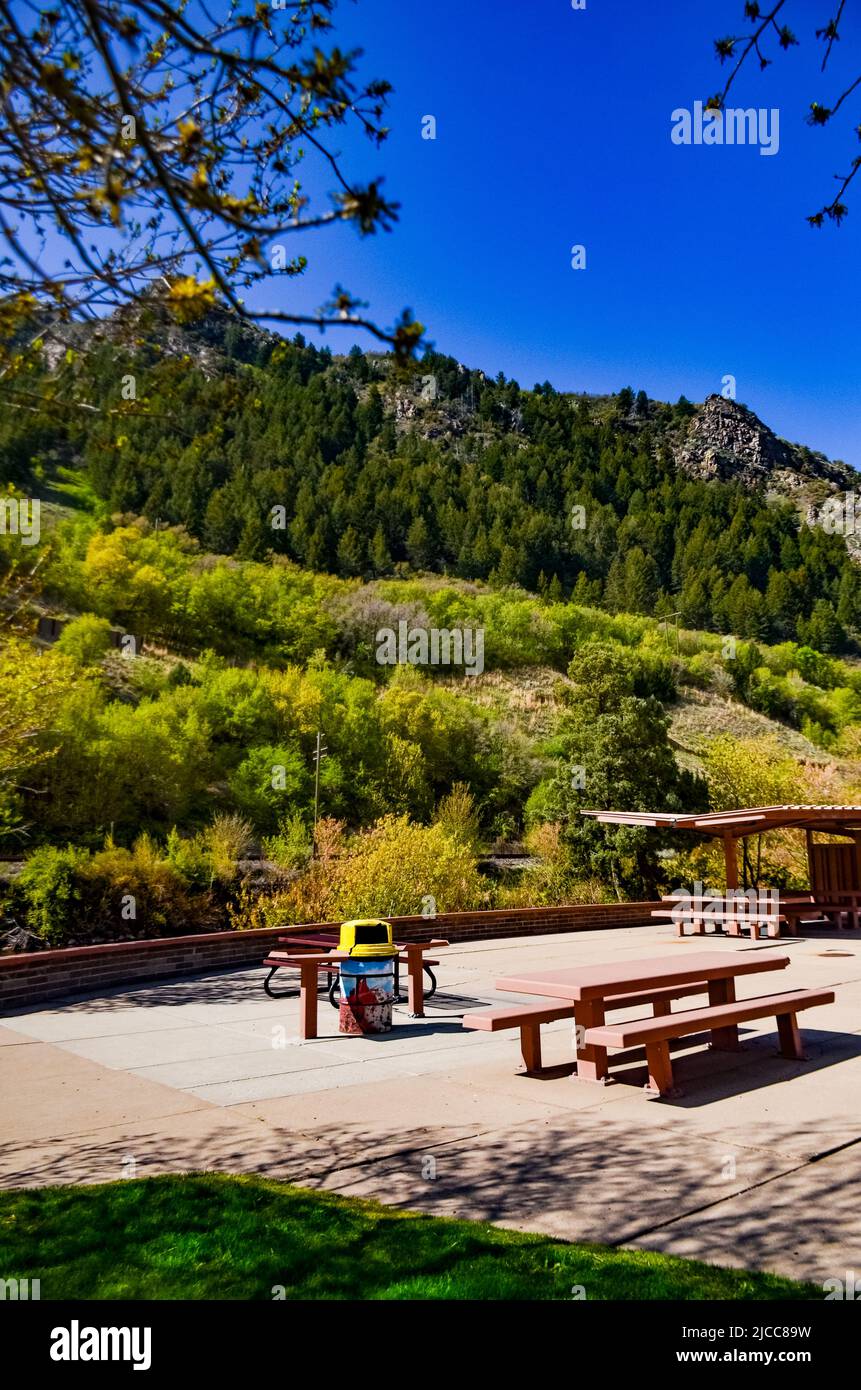 Table and benches in a recreation area near a small river in Utah, USA ...