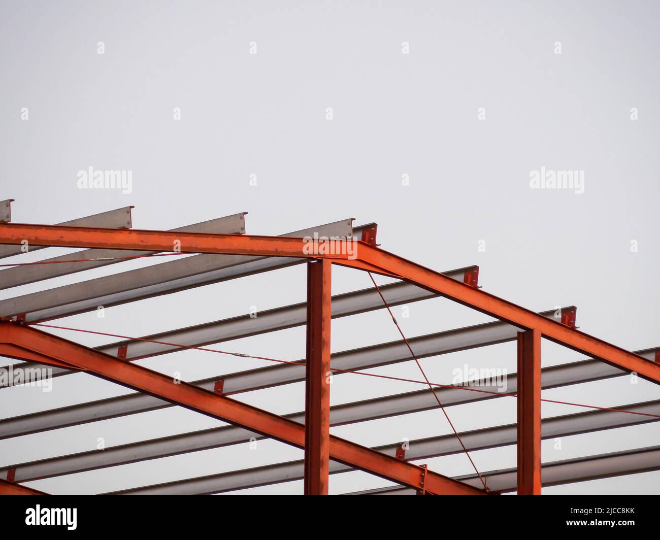 A metal structure of a building under construction on clear sky Stock ...