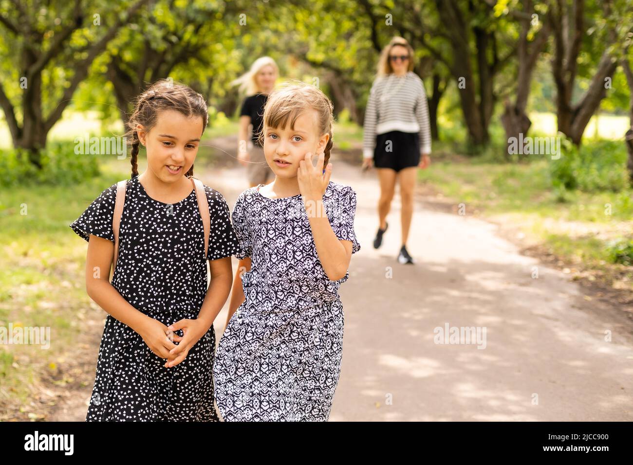 Basic school students crossing the road Stock Photo - Alamy
