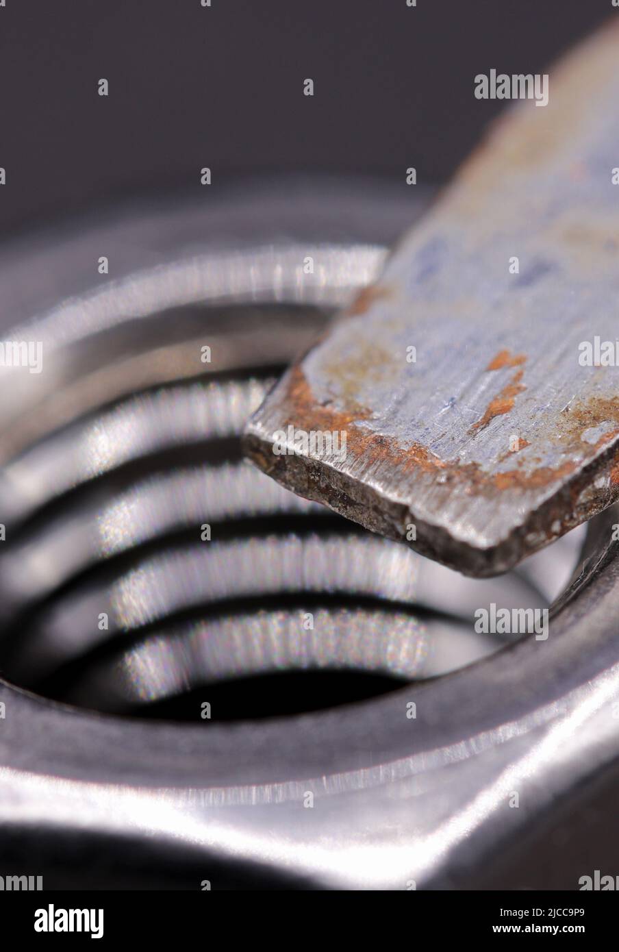 Small industrial objects close-up on a background Stock Photo - Alamy