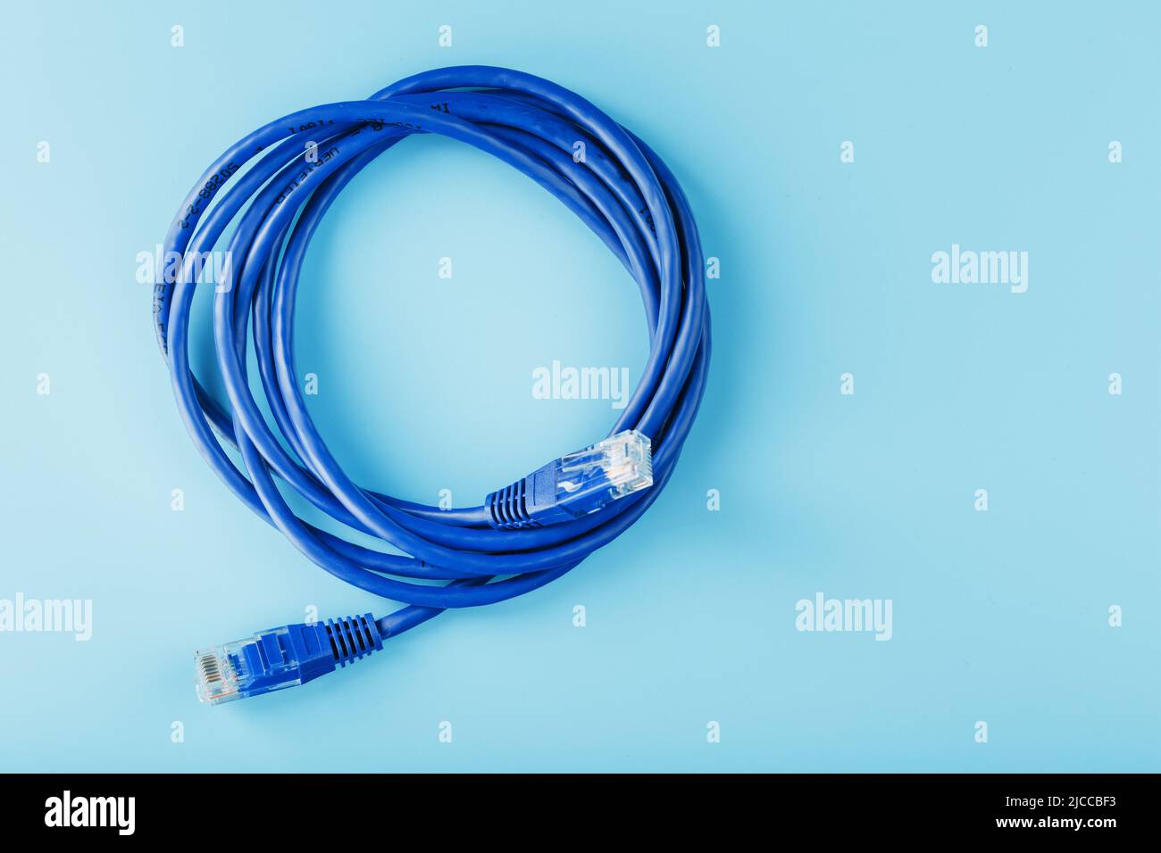Blue UTP Internet Cable - Isolated on a blue background Ethernet Cord ...