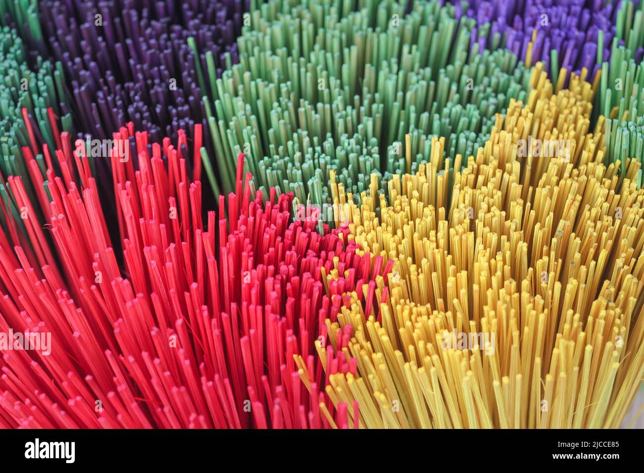 Bundles of abstract multi-colored bamboo sticks with high angle view ...
