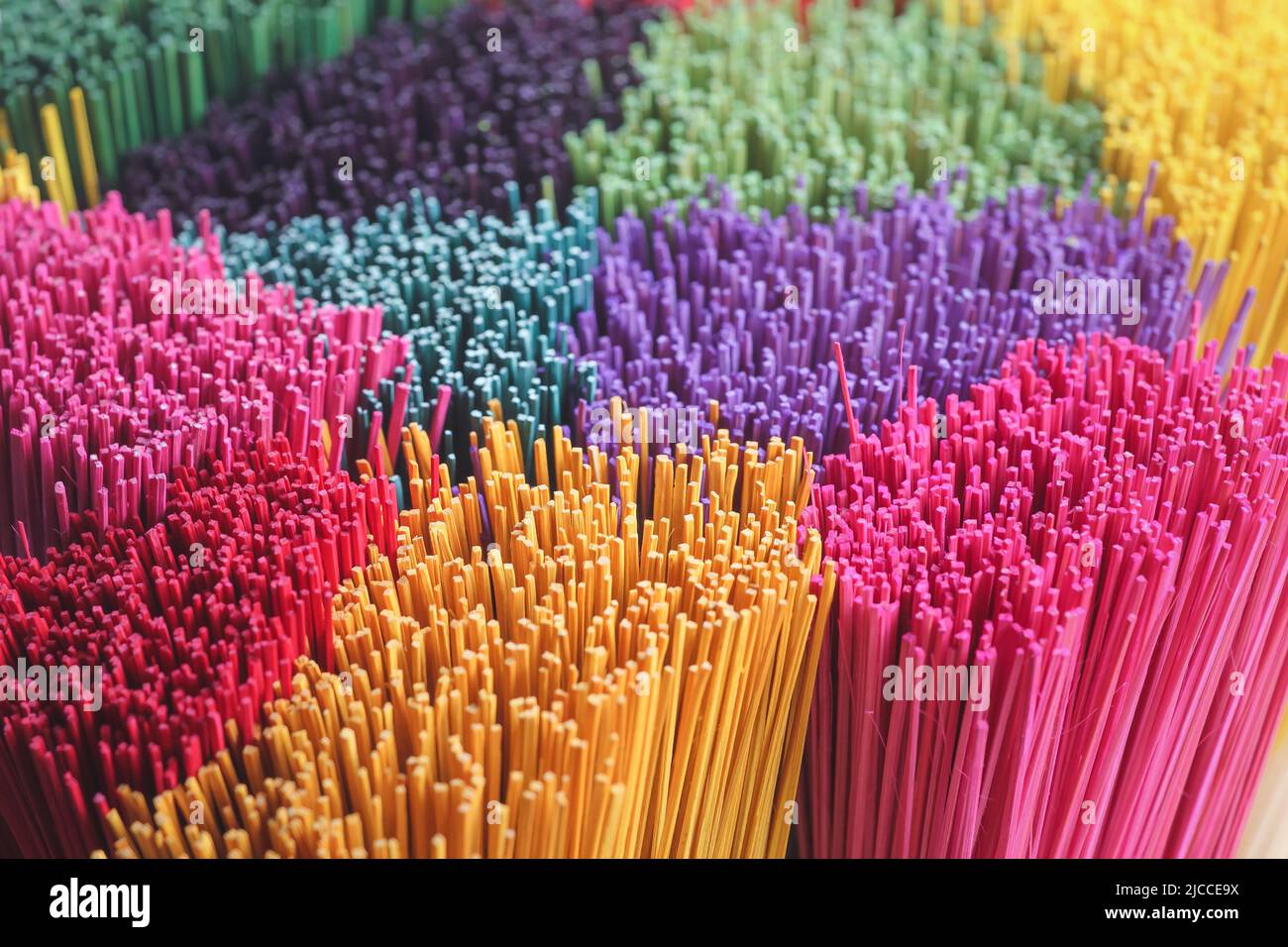Bundles of abstract multi-colored bamboo sticks with high angle view ...