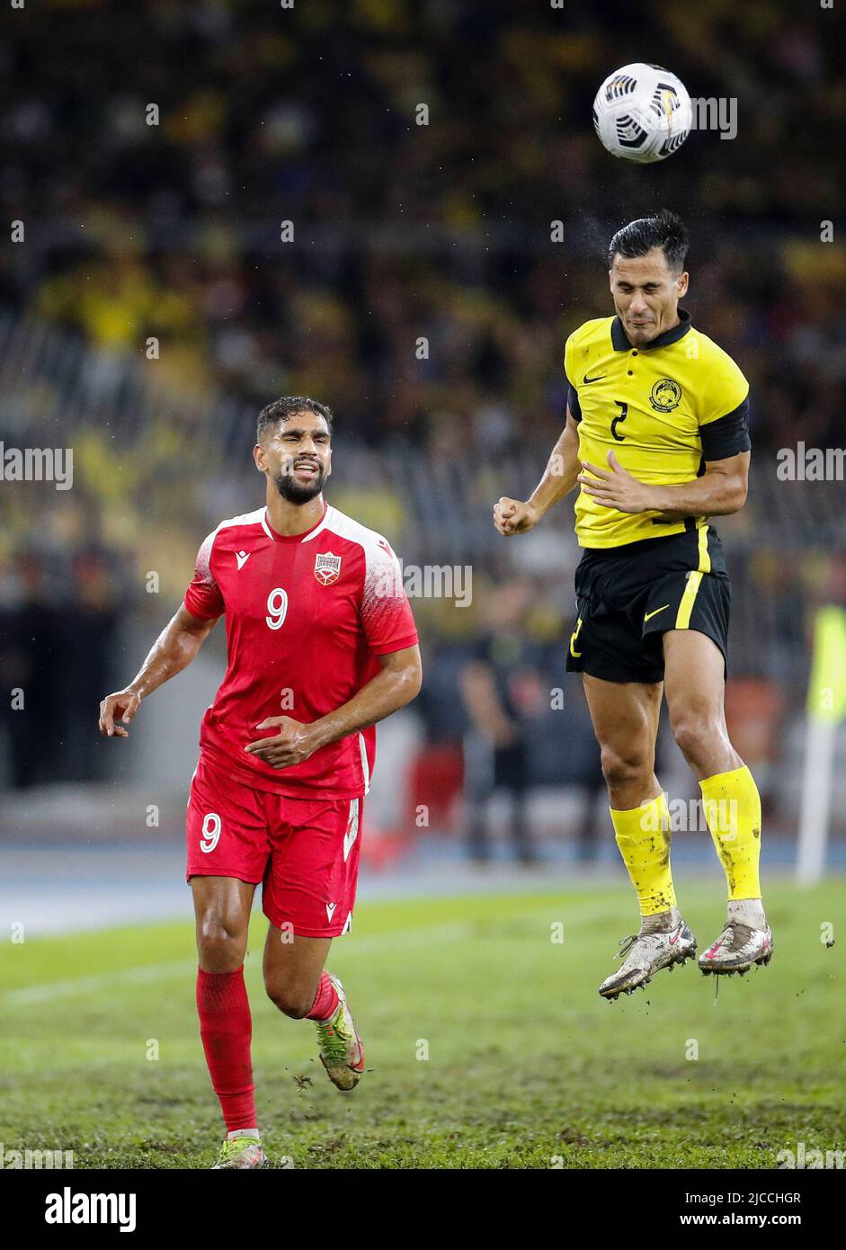 Matthew Davies (R) of Malaysia and Abdulla Yusuf Helal of Bahrain in ...