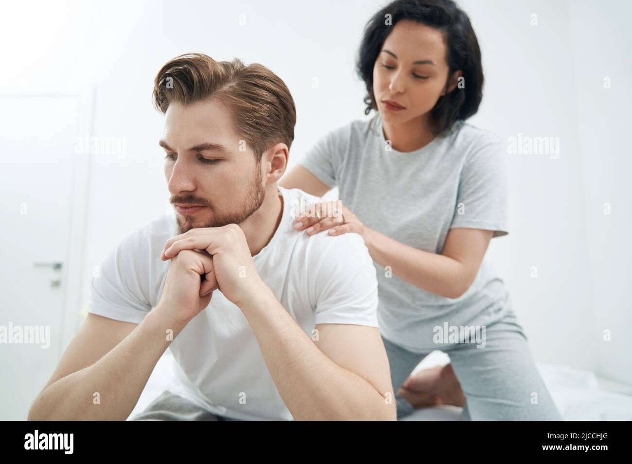 Affectionate lady giving her life partner relaxing massage Stock Photo ...