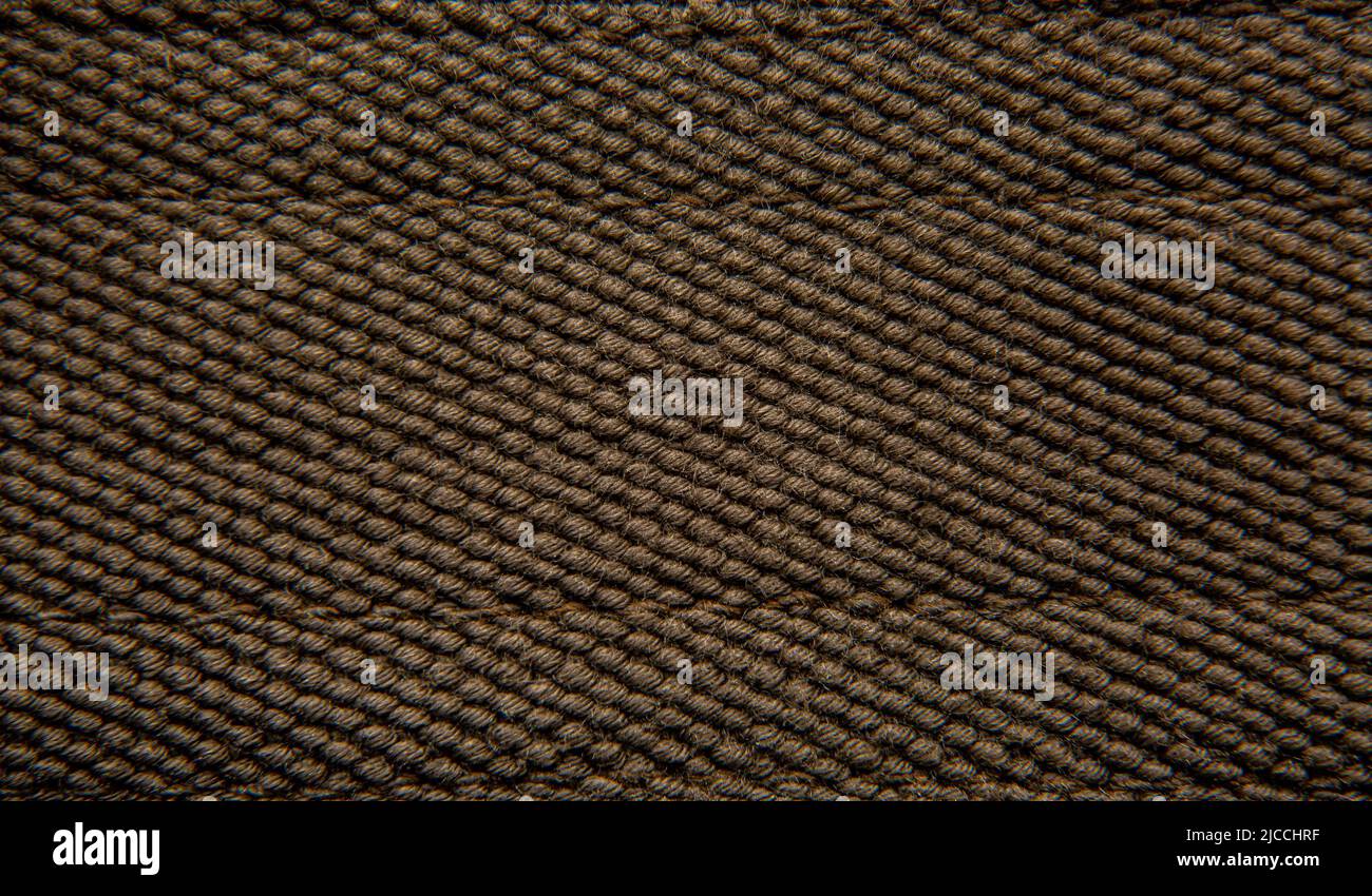 Close-up texture of a canvas fabric backpack. Leather straps and metal ...