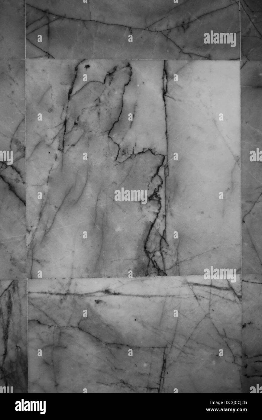 A vintage square marble tile lining a floor. in black and white Stock ...