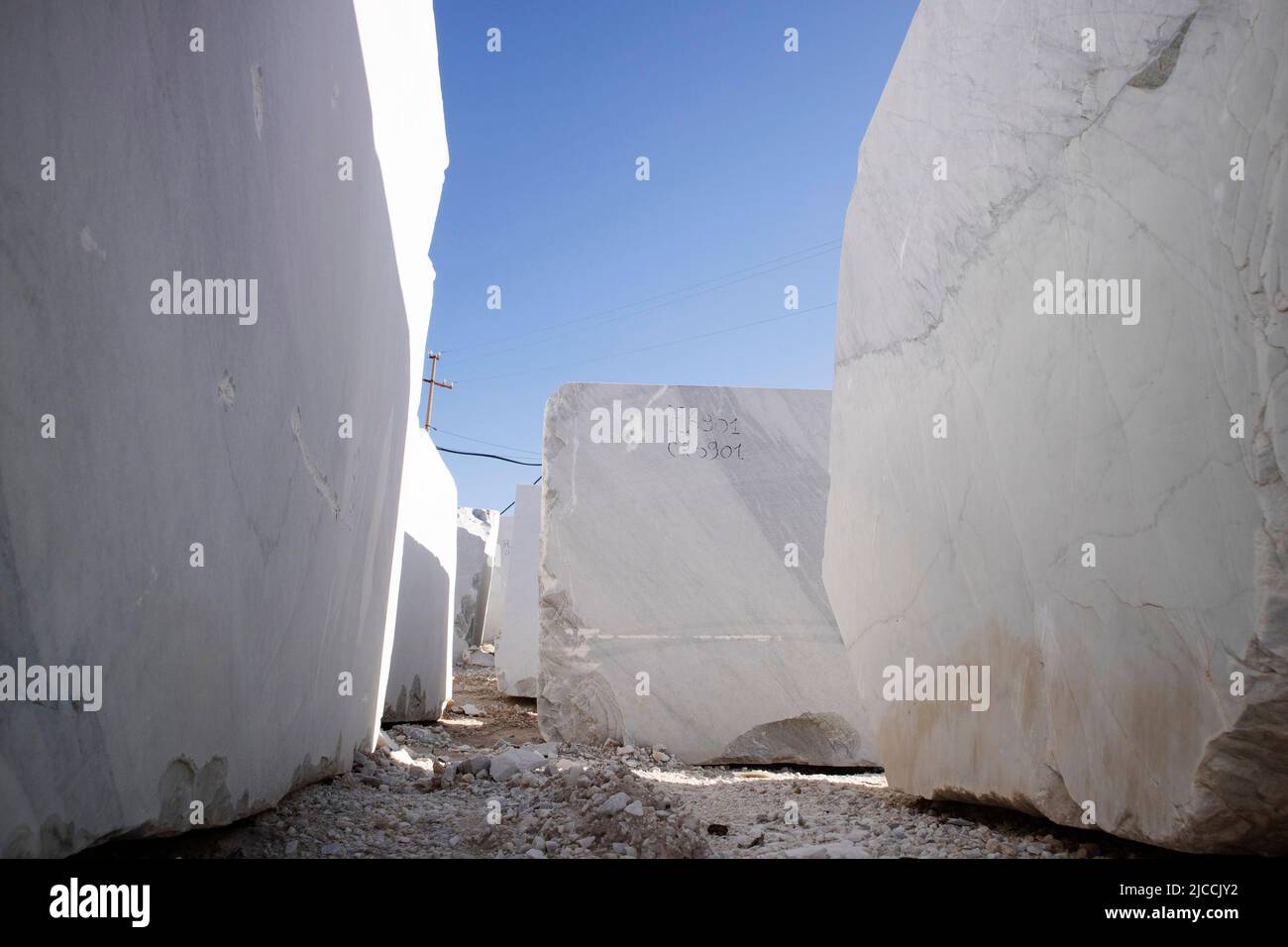Photographic documentation of a deposit of white marble blocks ready ...