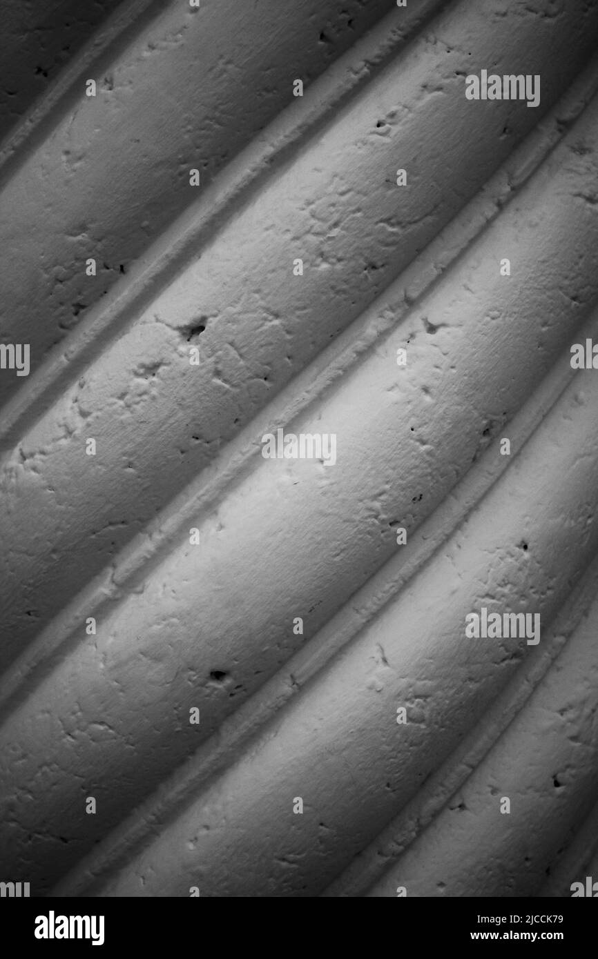 Beautiful carved stone on a column in a diagonal pattern in black and ...