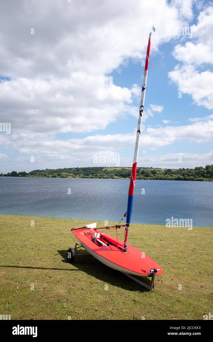Topper class sailing dinghies on grass at the edge of a lake Stock ...