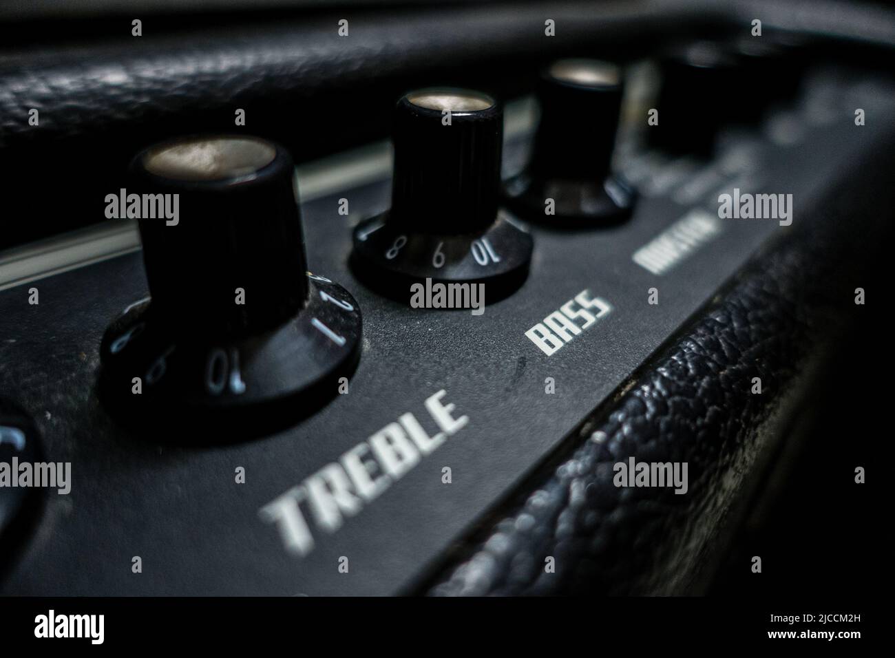 A top of a black guitar amplifier. treble, bass knobs. India Stock ...