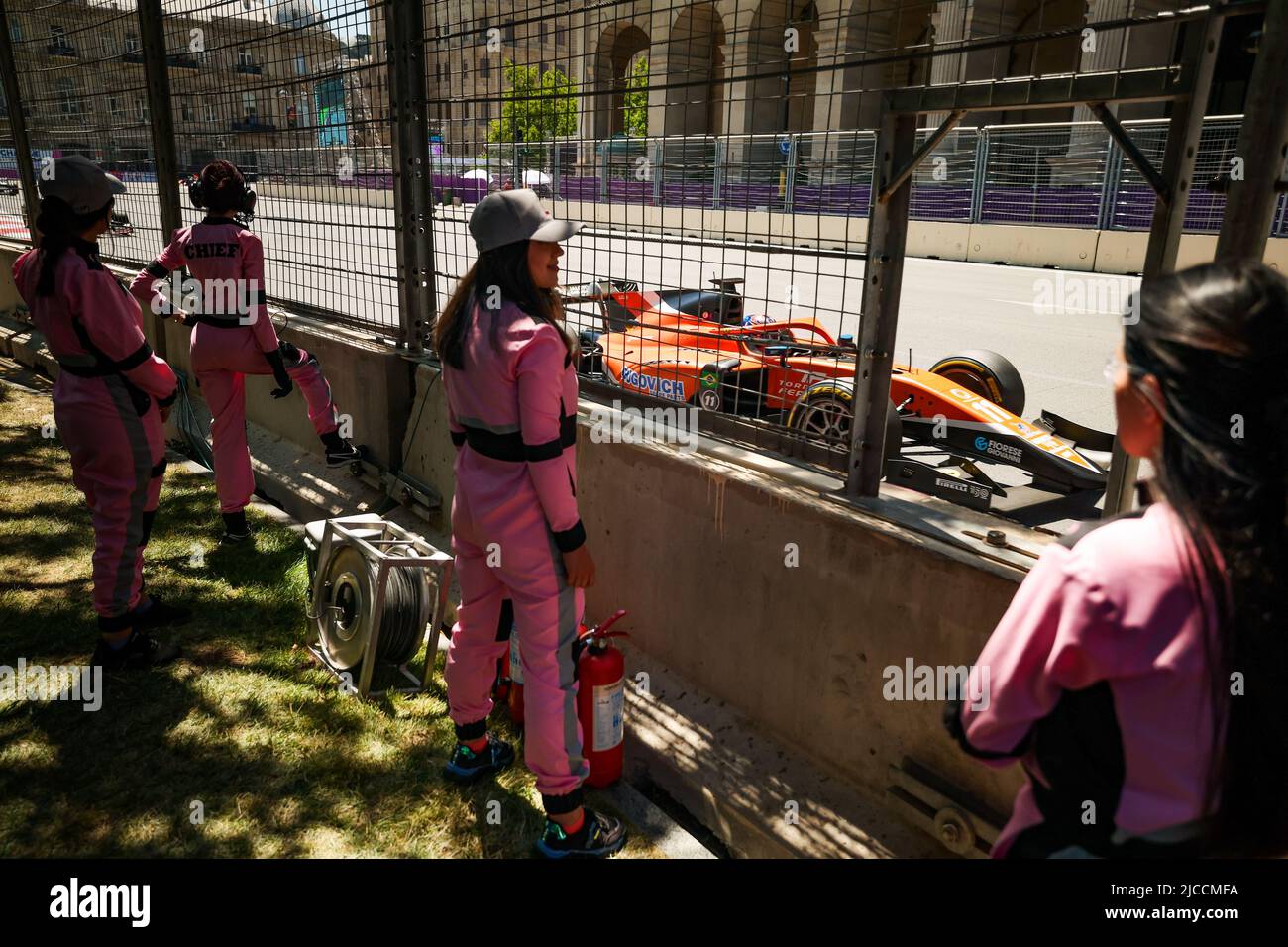 The women only marshals post alongside the track during the 6th round ...