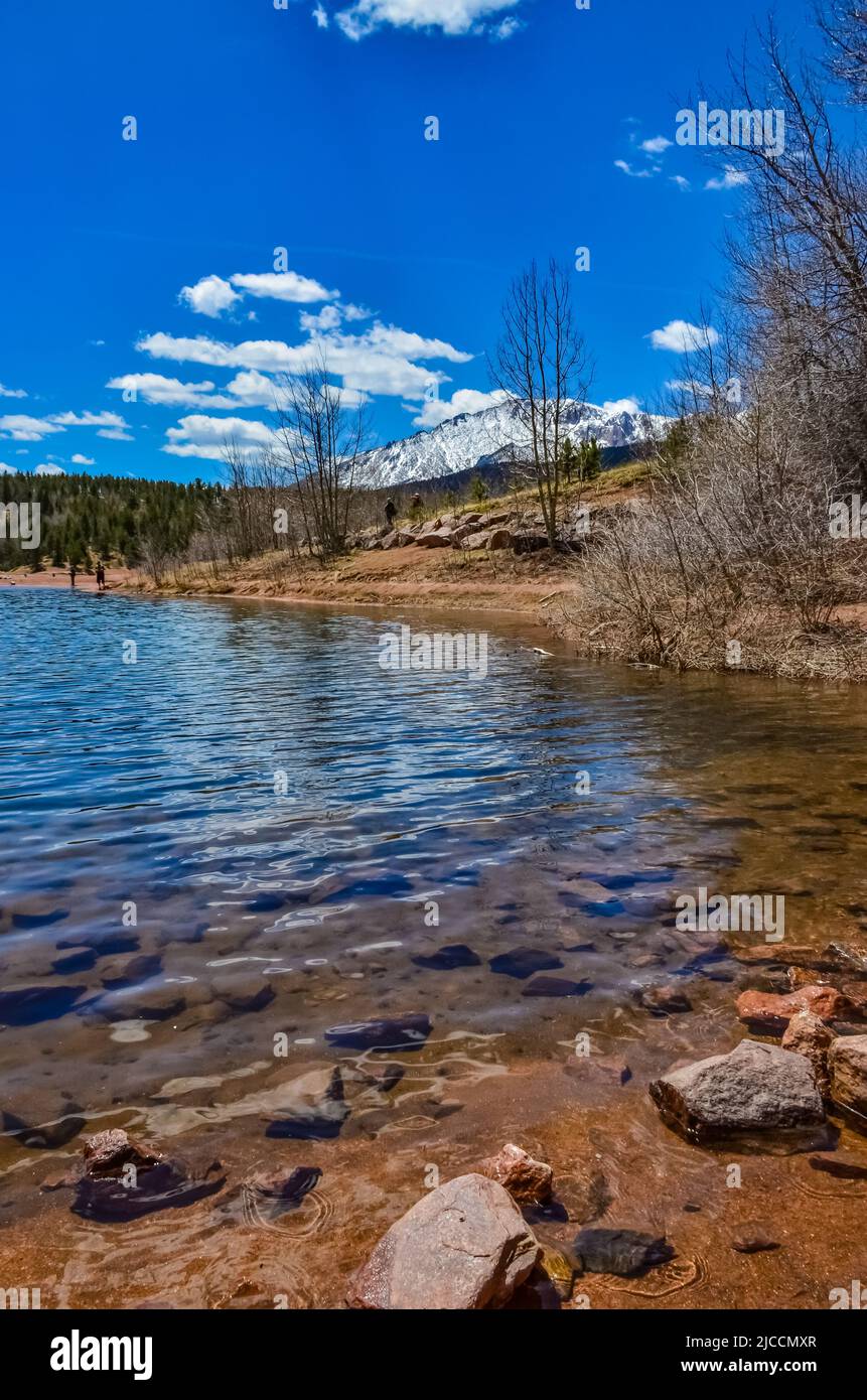 Crystal Creek reservoir near snow-capped mountains Pikes Peak Mountains ...