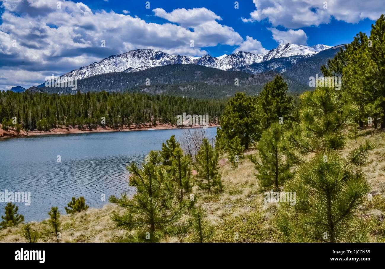 Crystal Creek reservoir near snow-capped mountains Pikes Peak Mountains ...