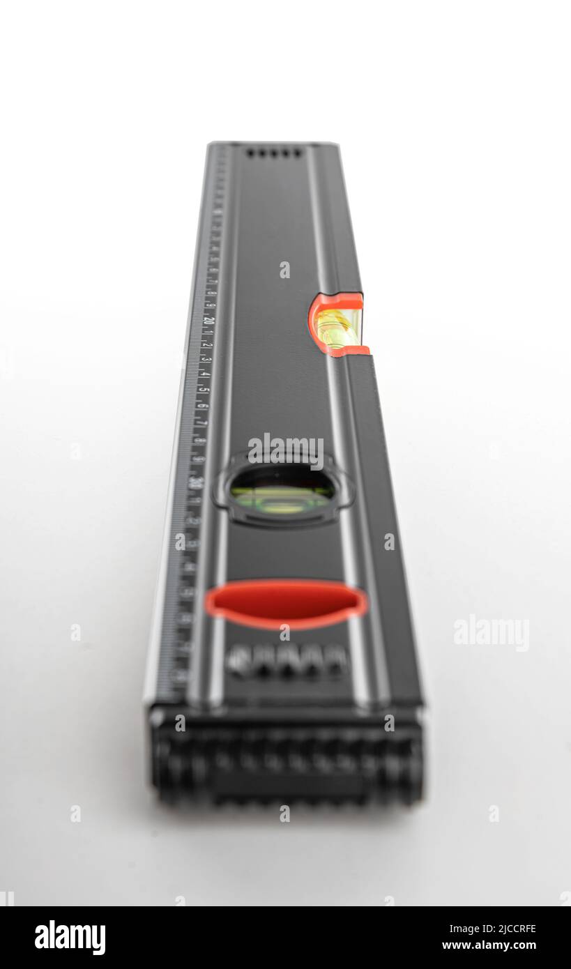 Magnetic building level isolated on white Stock Photo - Alamy