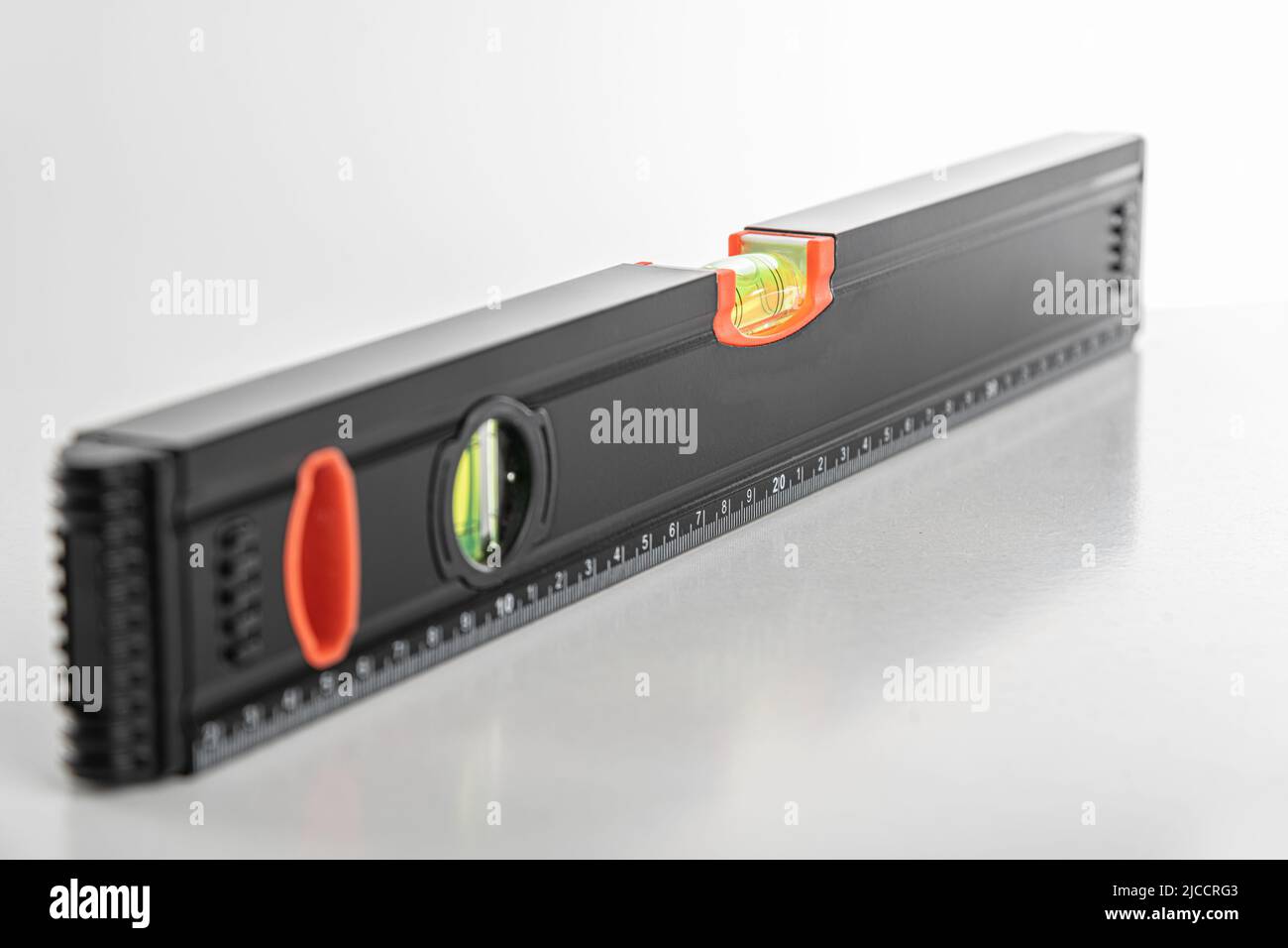 Magnetic building level isolated on white Stock Photo - Alamy