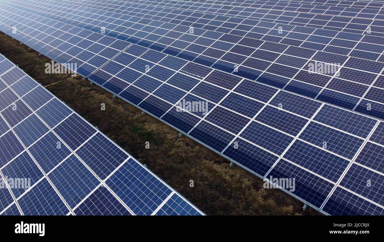 Aerial drone view flight over solar panels on sunny day close-up ...
