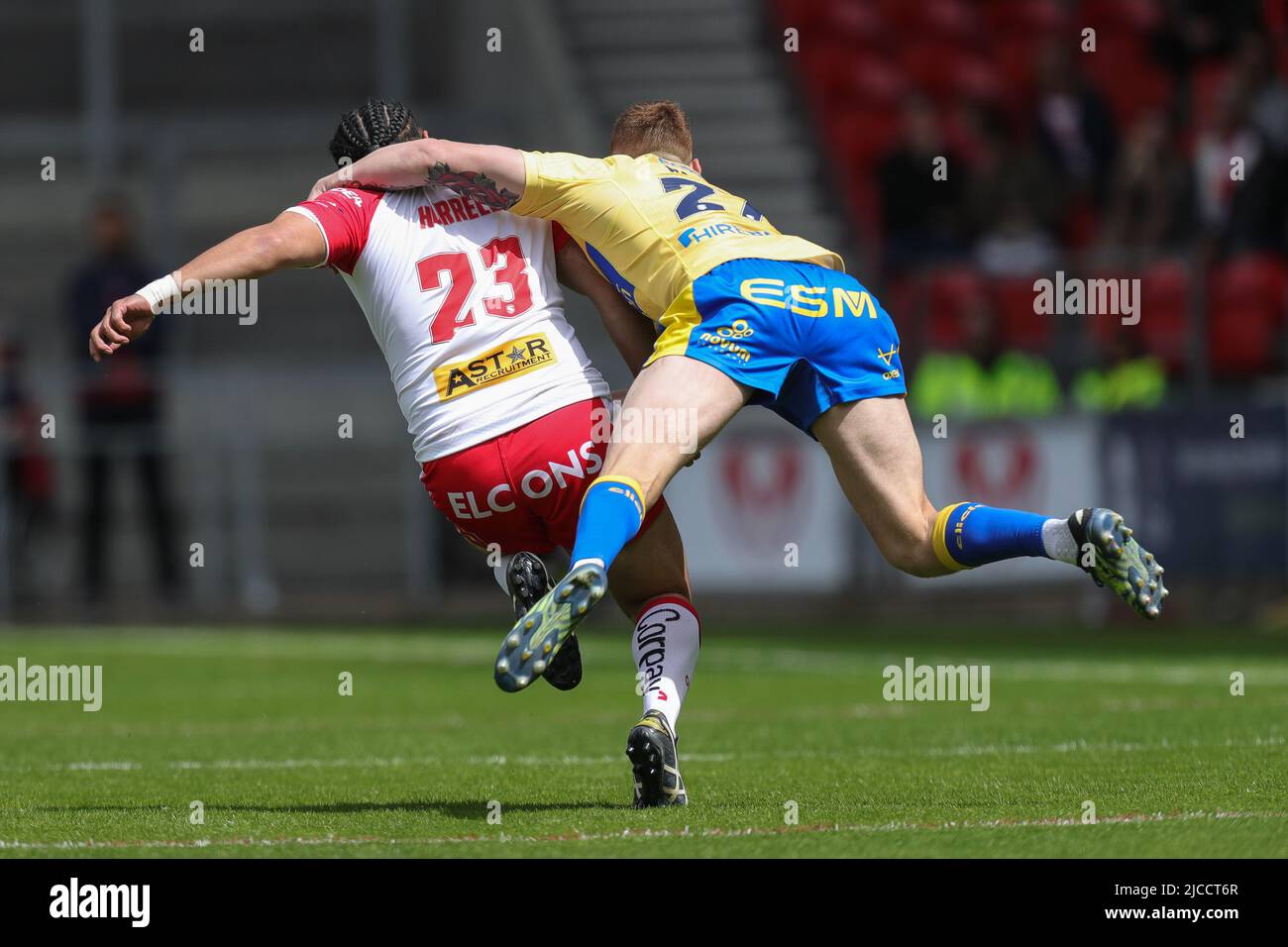 Frankie Halton #27 of Hull KR with a flying challenge on Konrad Hurrell ...